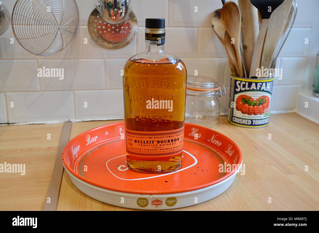 a glass bottle of bulleit bourbon kentucky whiskey 70cl on a tea tray ...