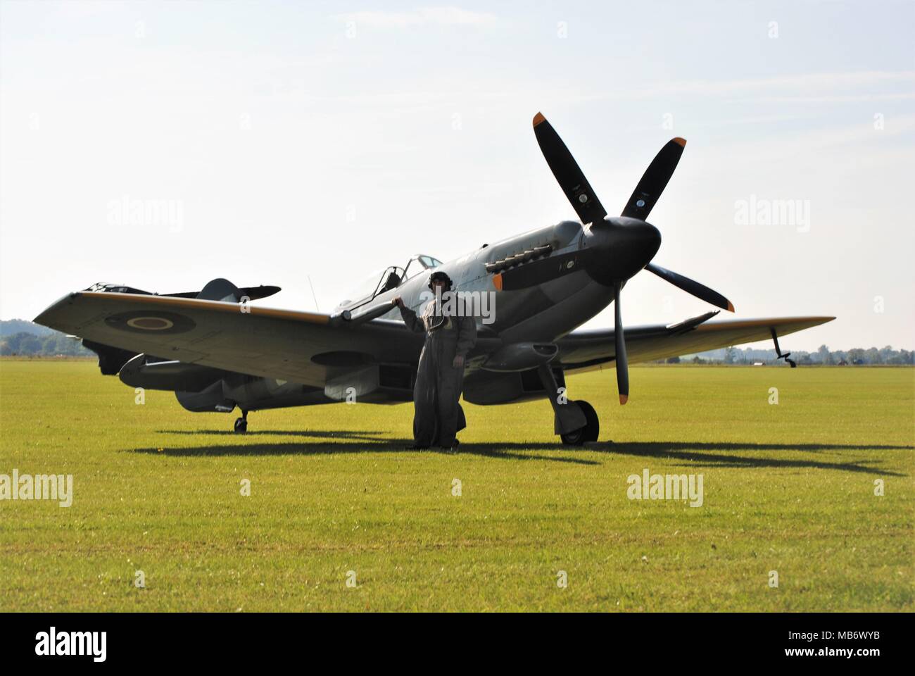 world war two spitfire with pilot leaning against it Stock Photo - Alamy
