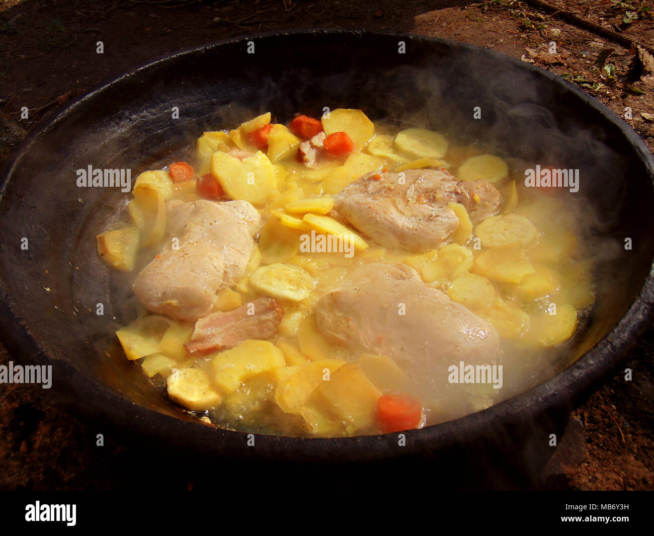 cooking in traditional way over wood fire relaxing day outside Stock ...