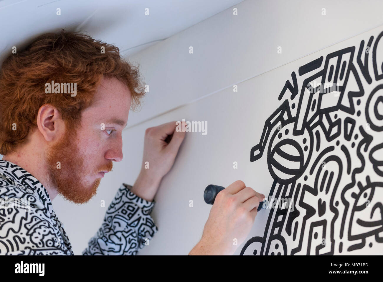 London, UK. 7 April 2018. The artist Mr Doodle creates his distinctive ...