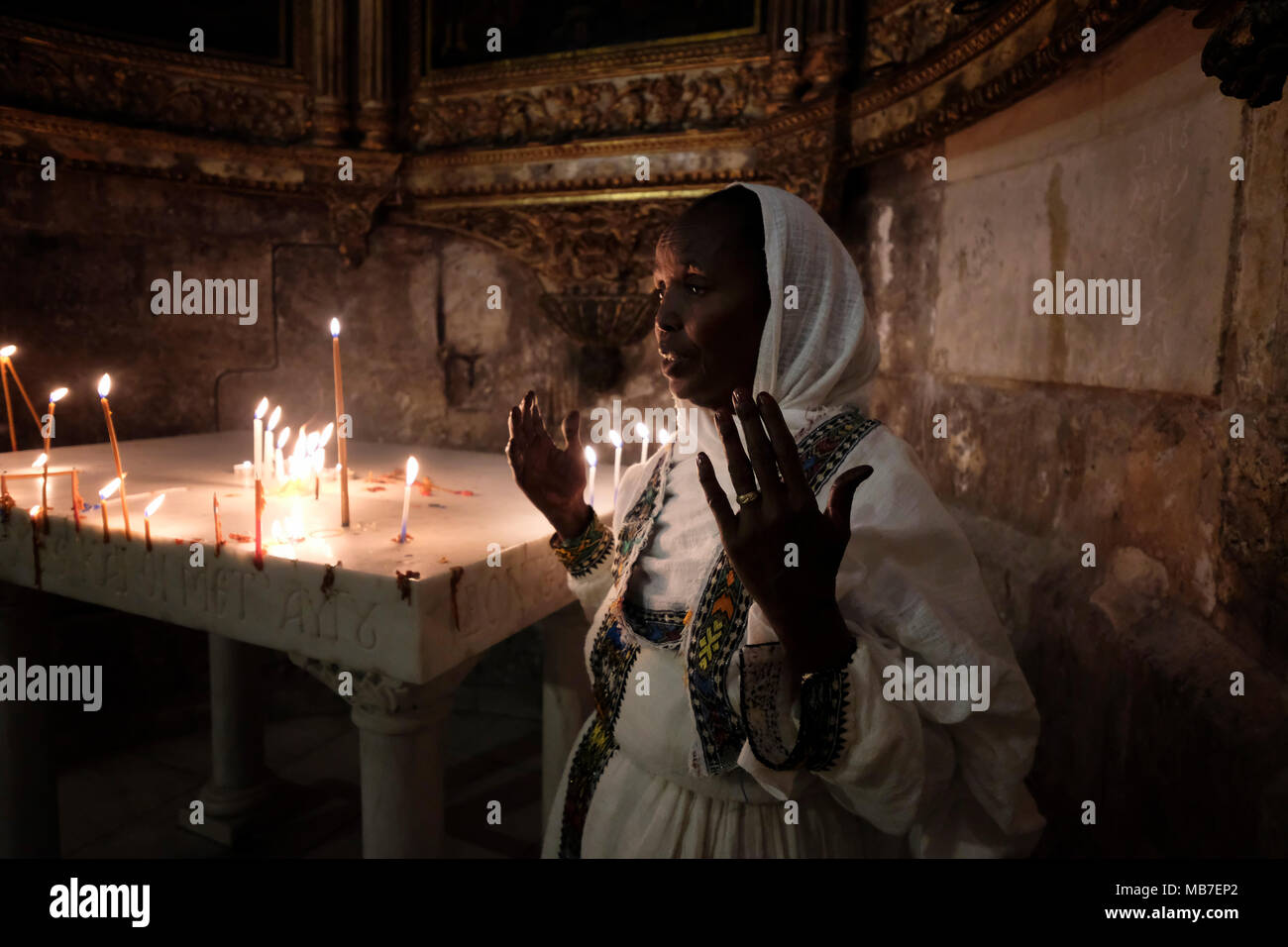 An Ethiopian Orthodox Christian pilgrim praying at the Greek Chapel of ...