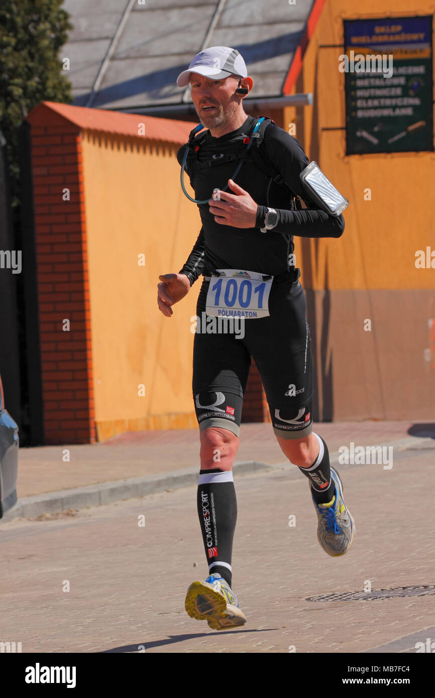 Checiny, Poland, 7th April, 2018. Runner on a street. CROSSRUN, amateur ...