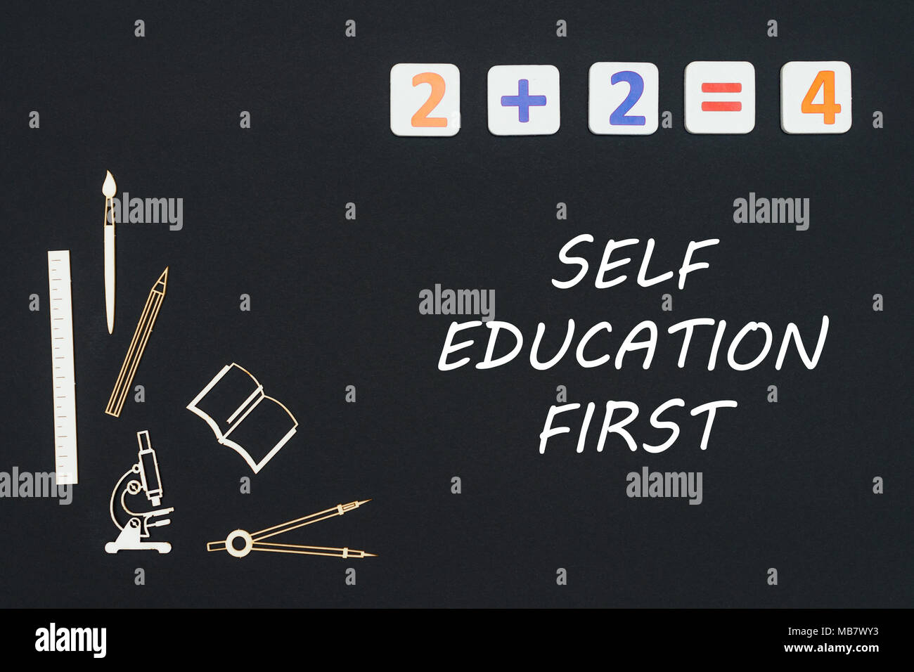 Concept first class school, text self education first with wooden ...