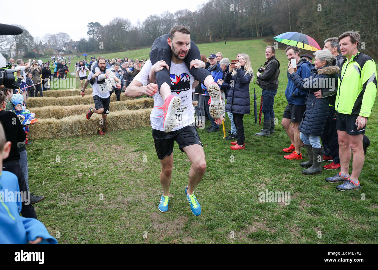 Chris Hepworth carries Tanisha Prince on their way to winning the ...