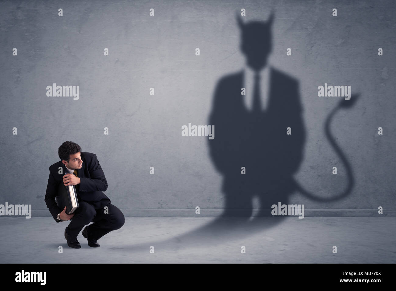 Business man looking at his own devil demon shadow concept background ...