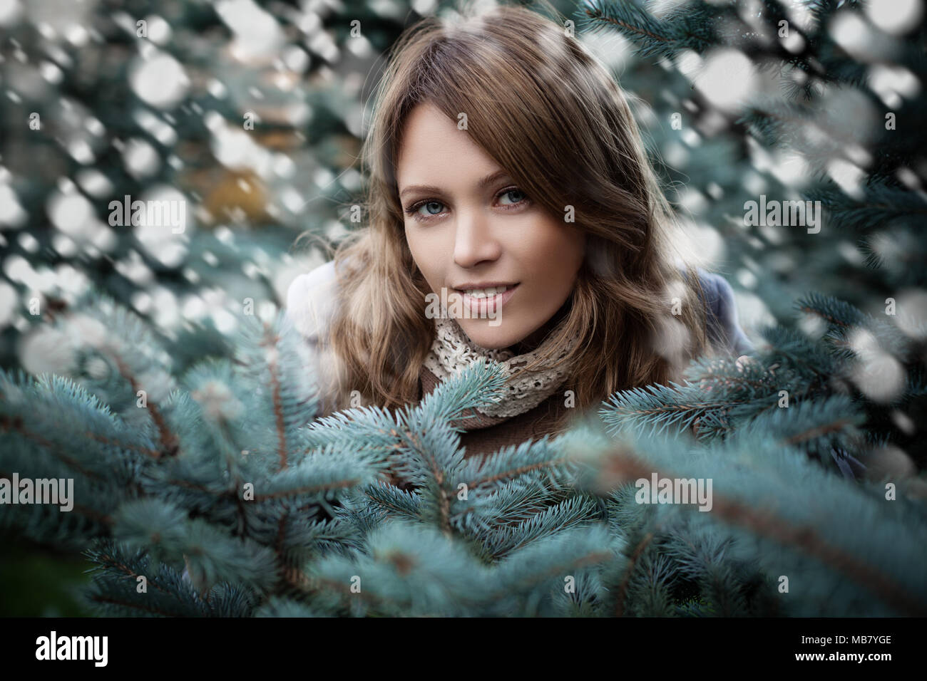 Beautiful Woman on Winter Background witn Snow and Fir Stock Photo - Alamy