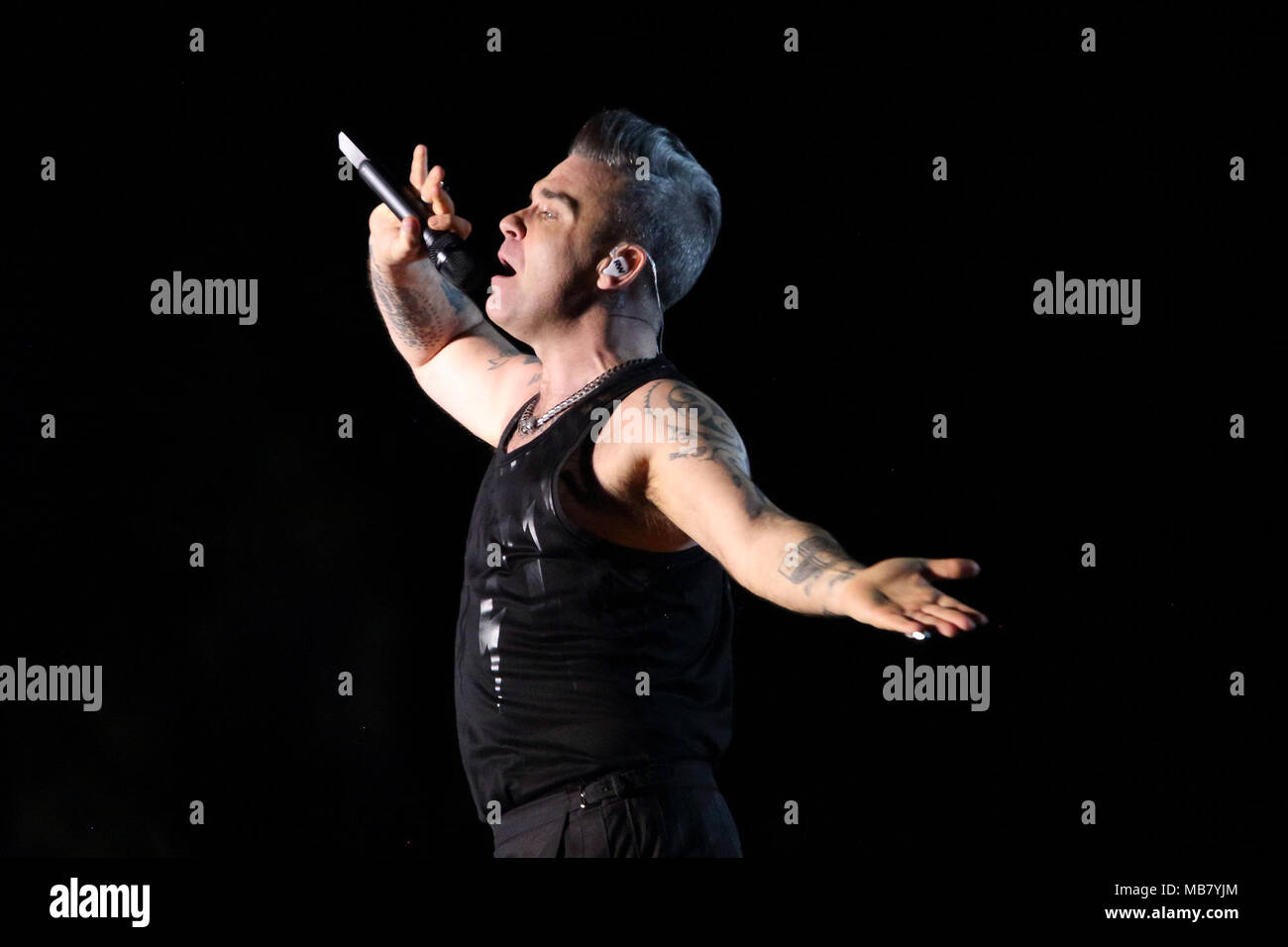Robbie Williams performing live in concert Featuring: Robbie Williams ...