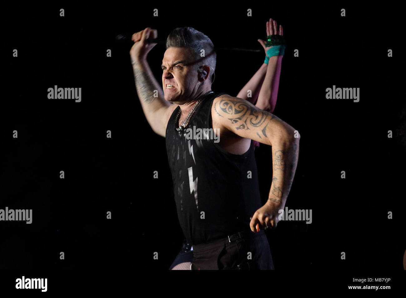 Robbie Williams performing live in concert Featuring: Robbie Williams ...