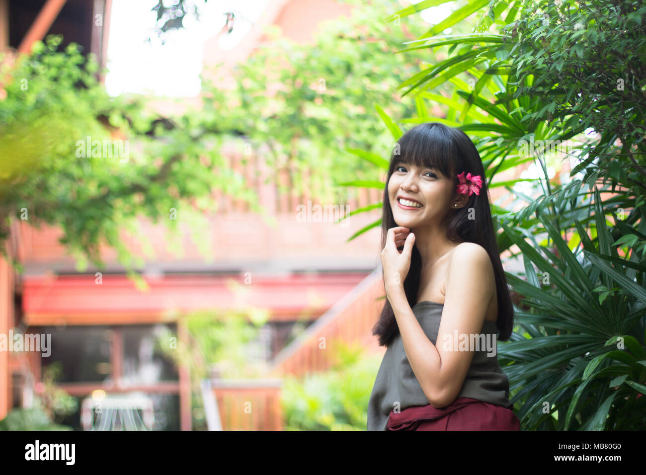 Nice and beautiful smiling Thai girl with Thai ancient style dressing ...