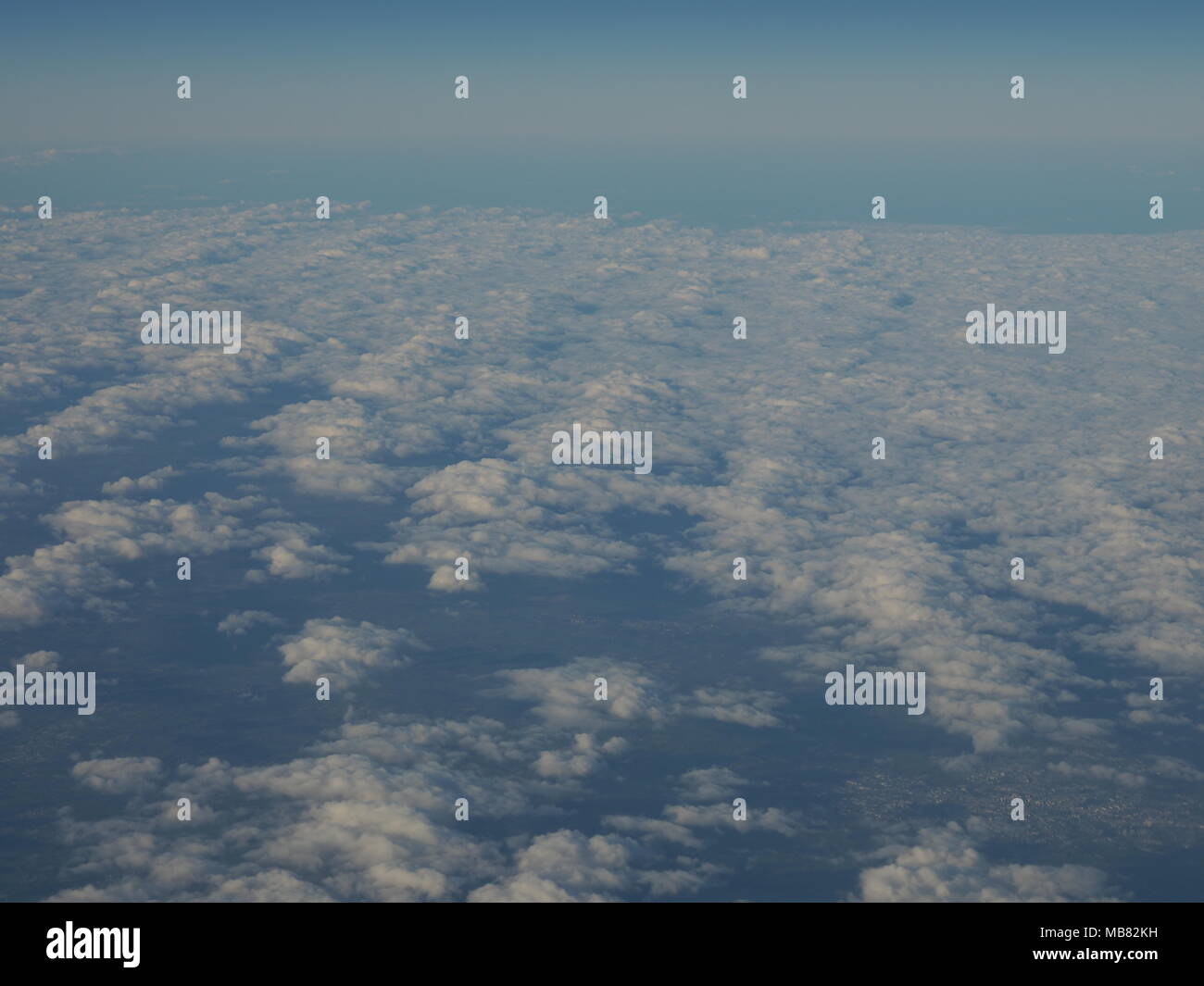 Scenic view of panorama of blue sky and cloud as seen through window of ...