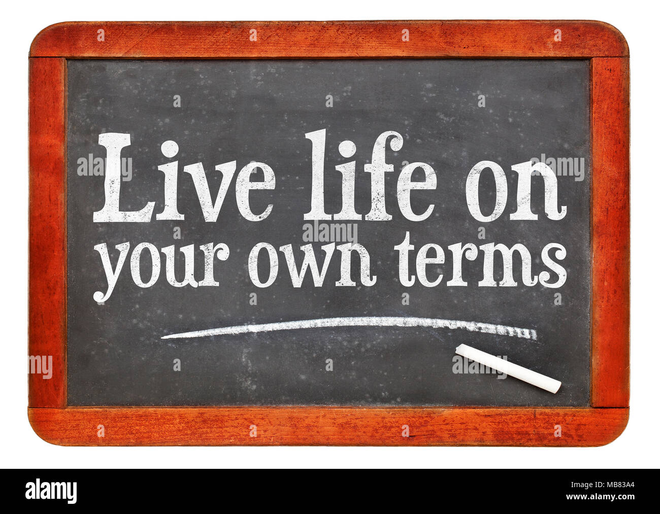 Live life on your own terms - white chalk text on a vintage slate ...