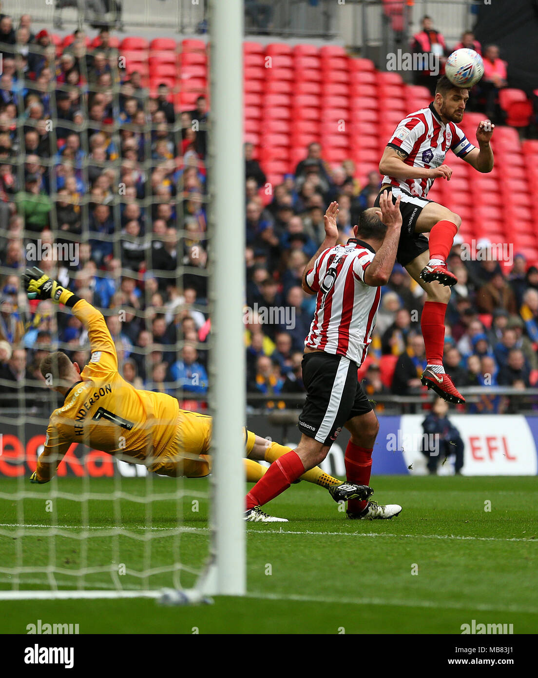 Lincoln City's Matt Rhead collides with Shrewsbury Town's Dean ...