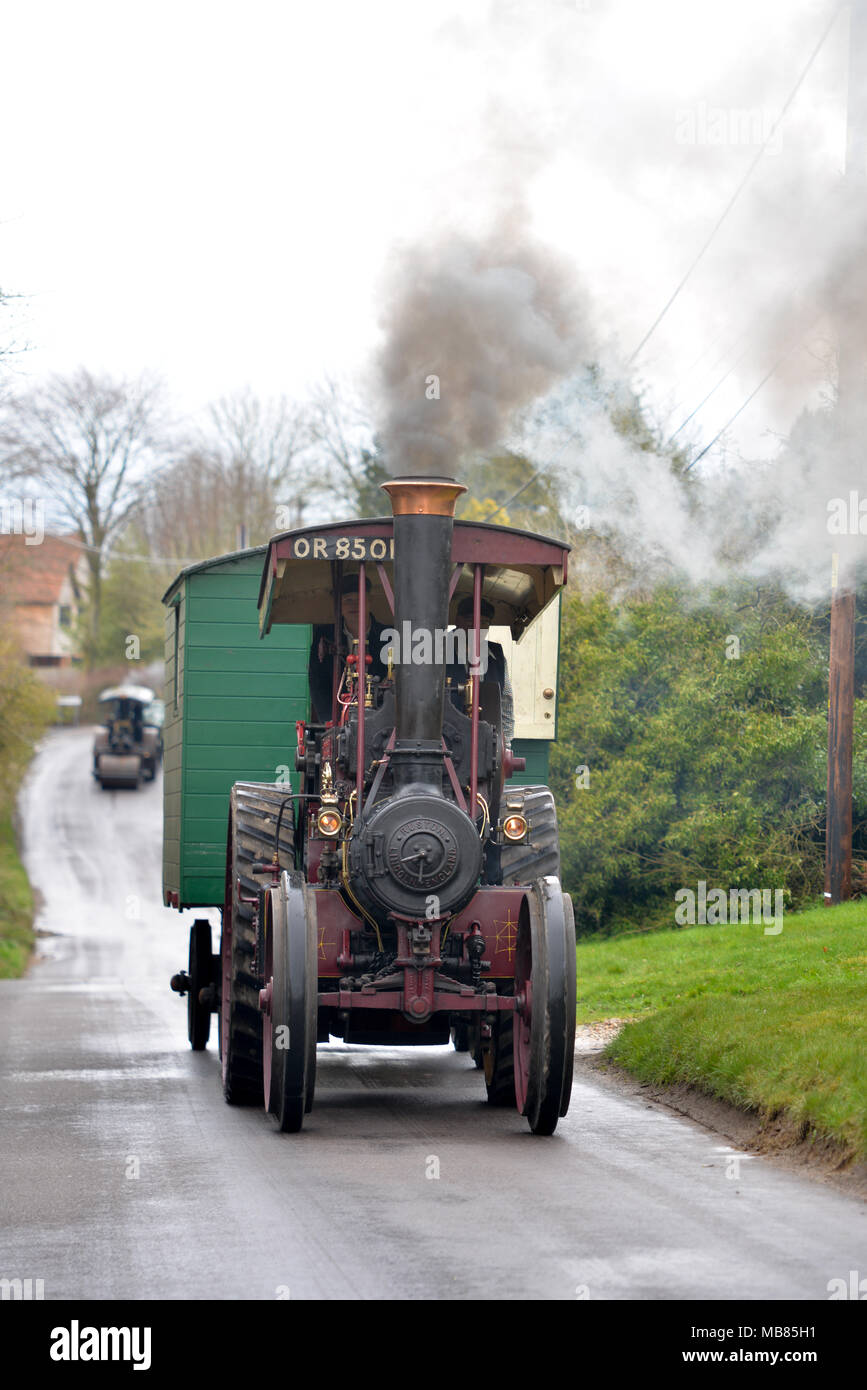 Steam rollers and traction engines in a vintage road works scene, steam ...