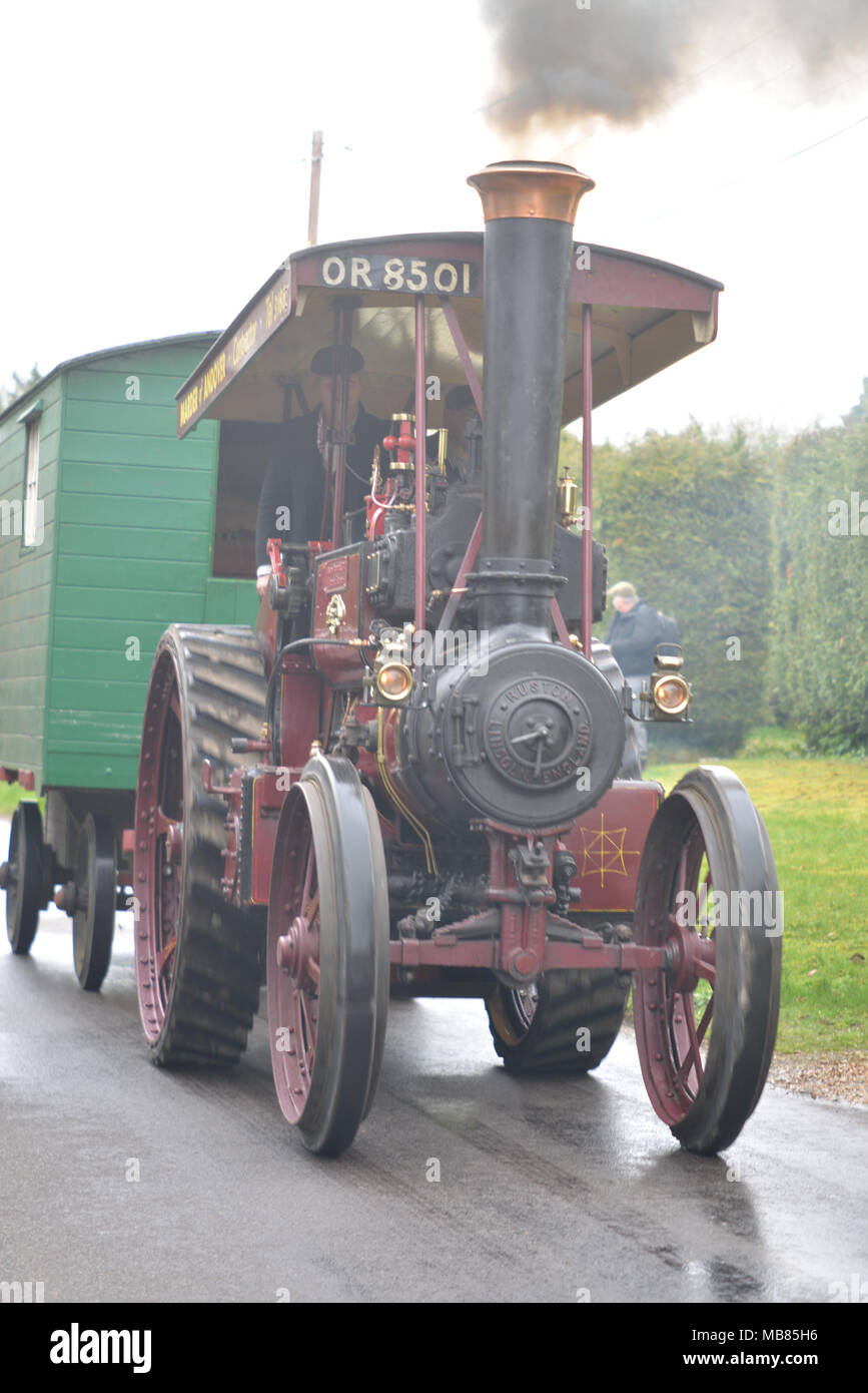 Steam rollers and traction engines in a vintage road works scene, steam ...