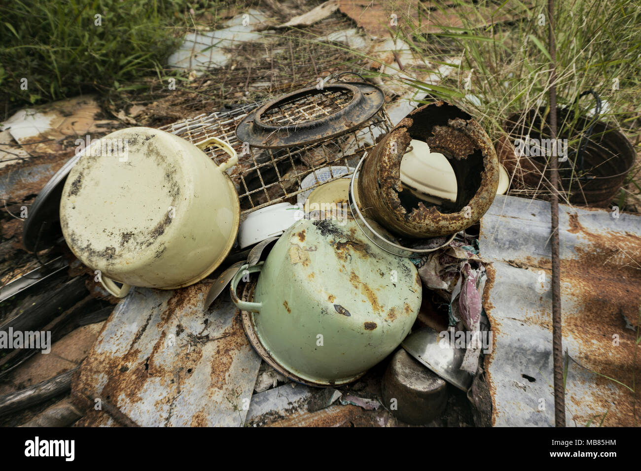 Kitchen scrap metal lying on top of rusty zinc roofing Stock Photo - Alamy