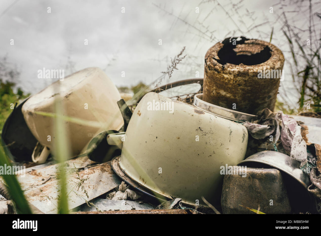 Kitchen scrap metal lying on top of rusty zinc roofing Stock Photo - Alamy