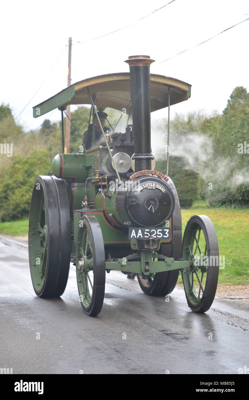 Steam rollers and traction engines in a vintage road works scene, steam ...