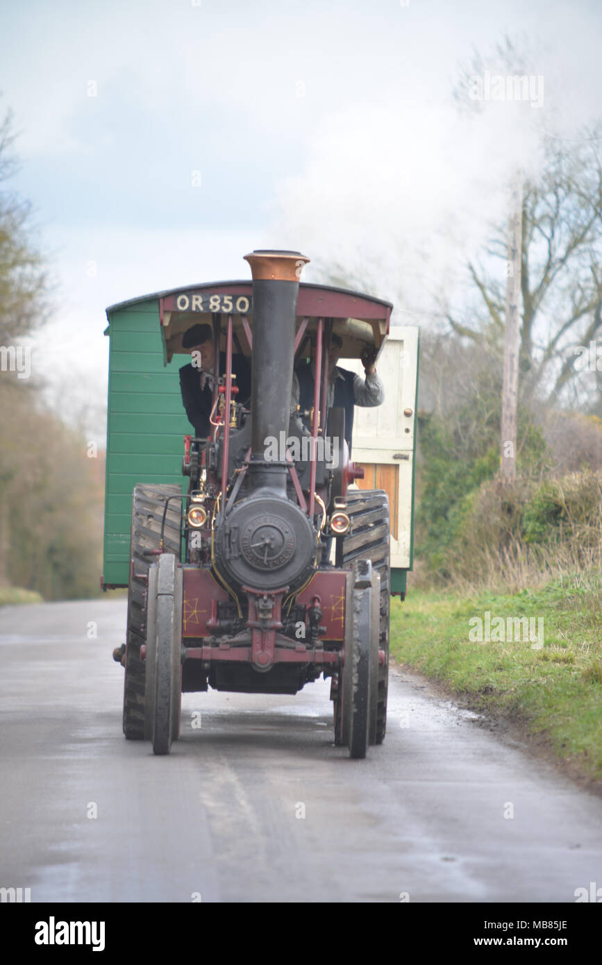 Steam rollers and traction engines in a vintage road works scene, steam ...