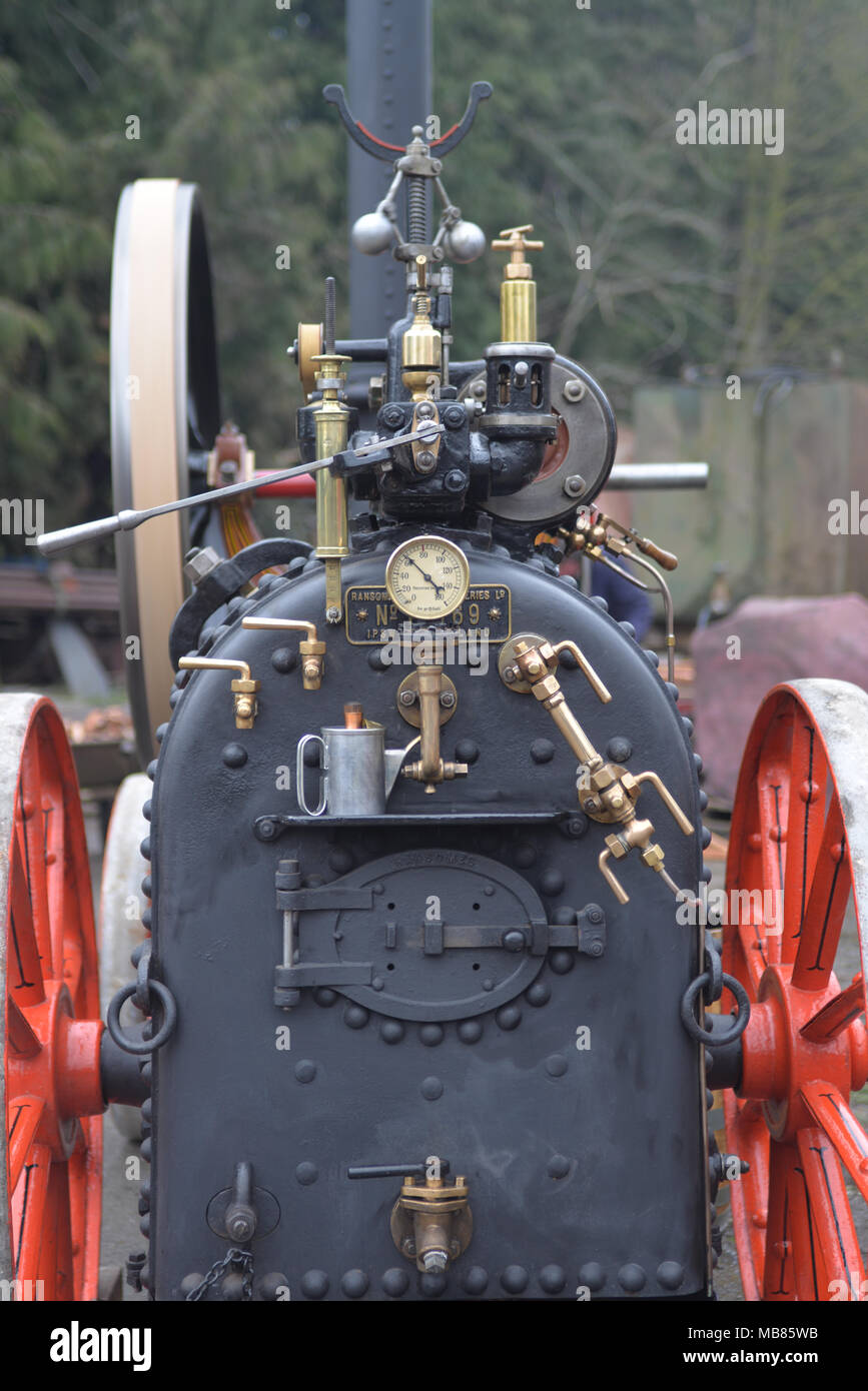 Steam rollers and traction engines in a vintage road works scene, steam ...