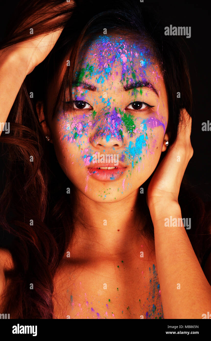 Holi Powder On Female Model Posing Stock Photo - Alamy