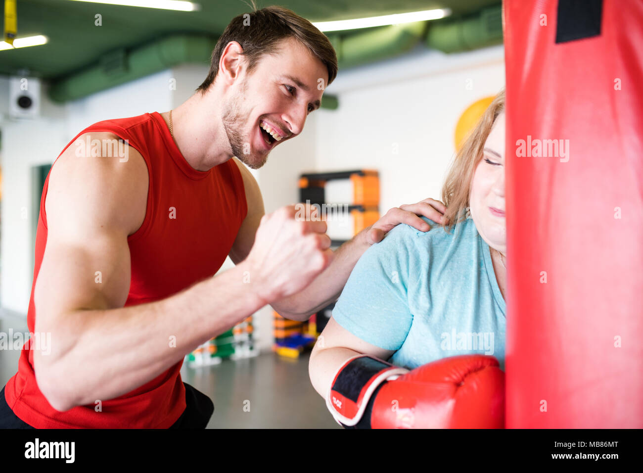 Personal Fitness Trainer Motivating Client Stock Photo - Alamy