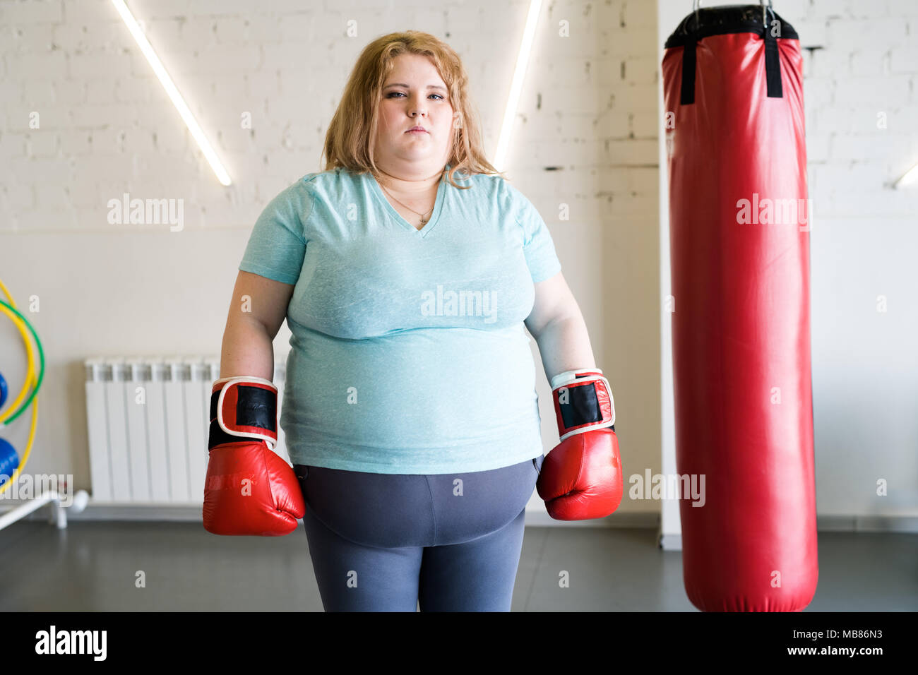 Fat young woman posing hi-res stock photography and images - Alamy