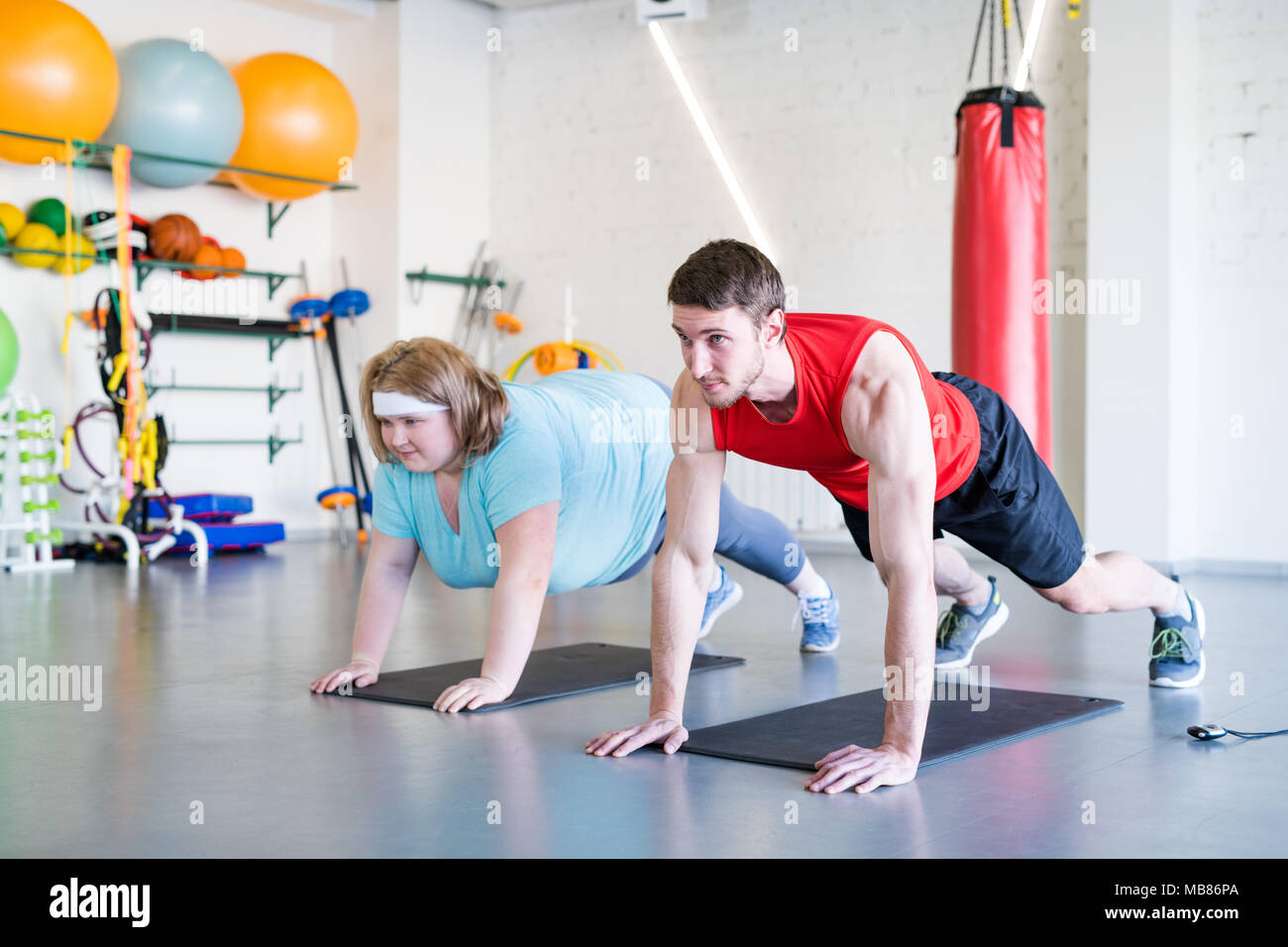 Obese Woman Working Out in Fitness Club Stock Photo - Alamy