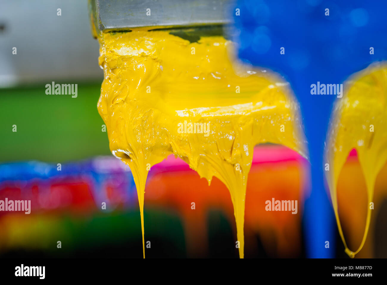 colorful of plastisol ink stick on printer handle start flowing down ...