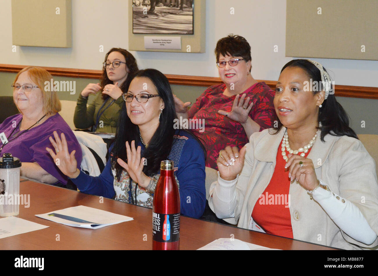 Participants sign "how are you? I'm great" during an American Sign ...