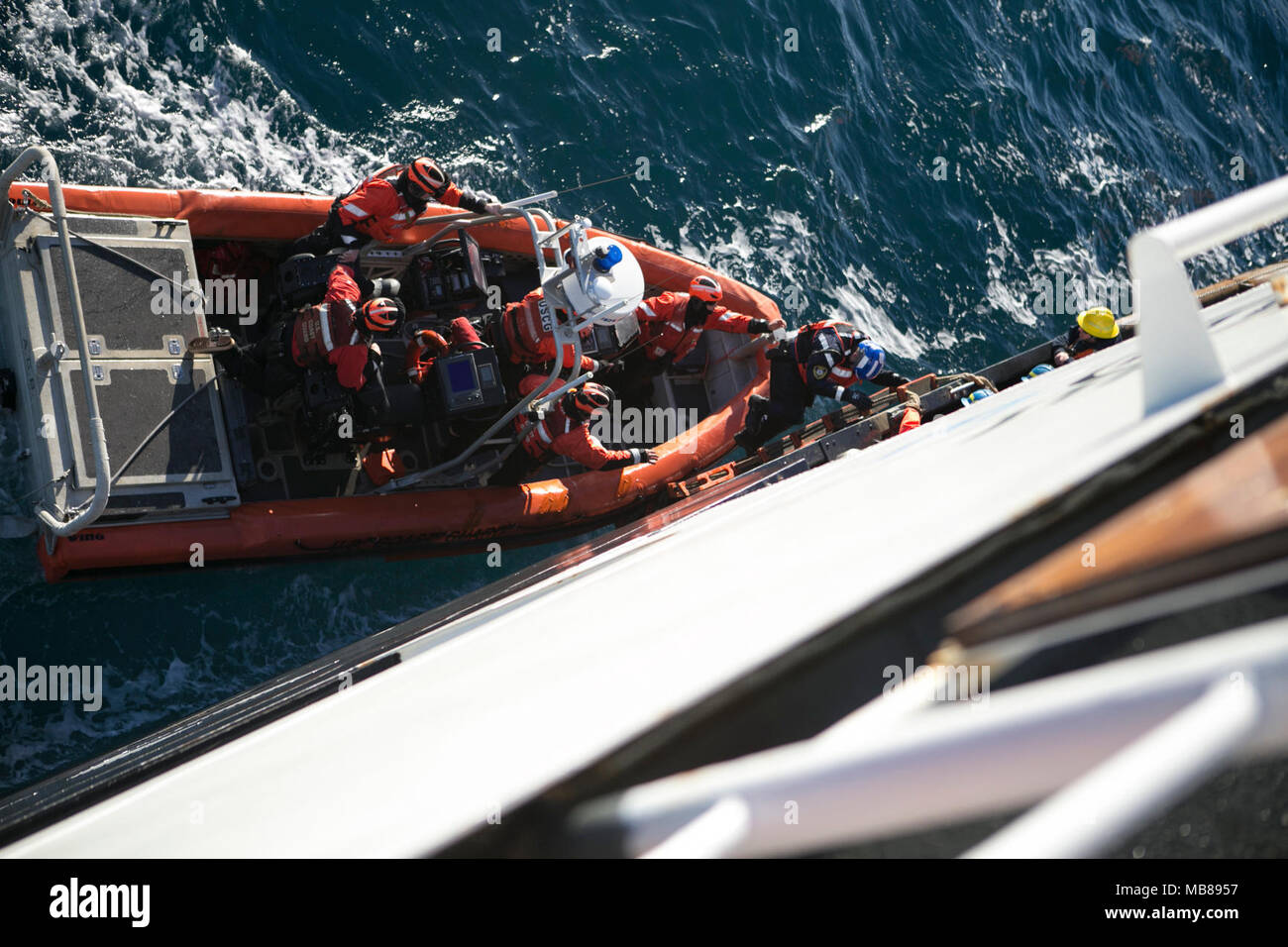 A Coast Guard Cutter SPAR smallboat crew prepares to conduct a law ...