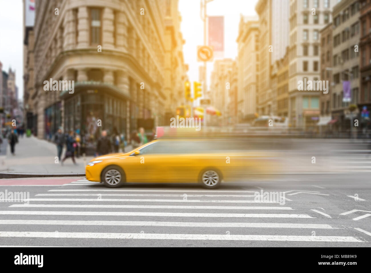 New York City yellow taxi cab in motion across Broadway in Manhattan ...