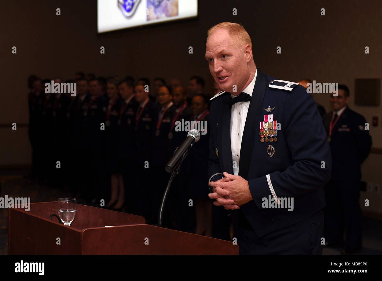 Col. Michael Hough, 30th Space Wing commander, congratulates Airman ...