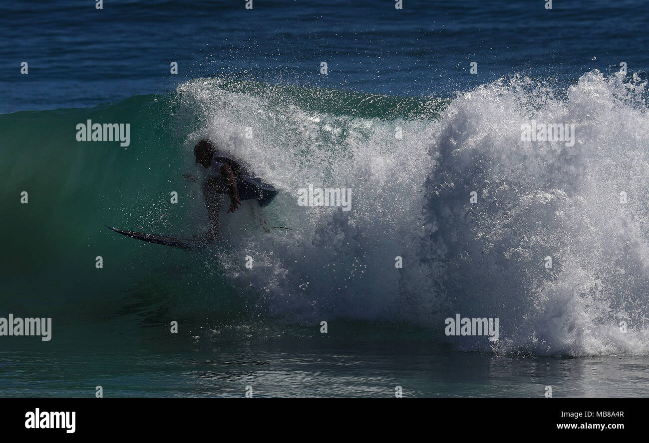 A surfer on Coolangatta Beach during day five of the 2018 Commonwealth ...