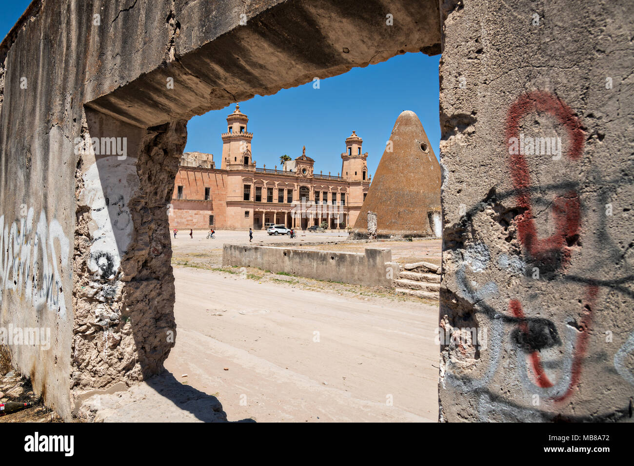 The pyramid shaped granaries and the front towers of the Hacienda de ...