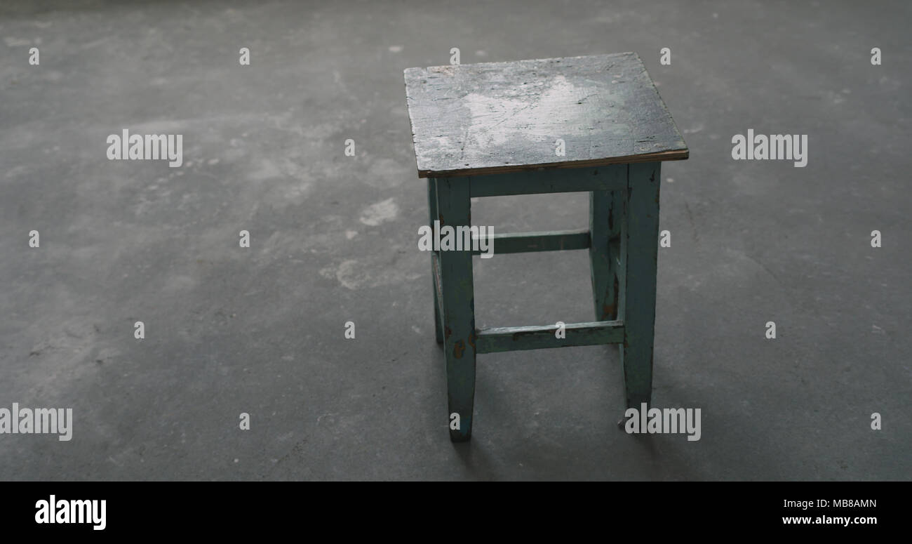 old stool in empty room during renovation, wide photo Stock Photo - Alamy