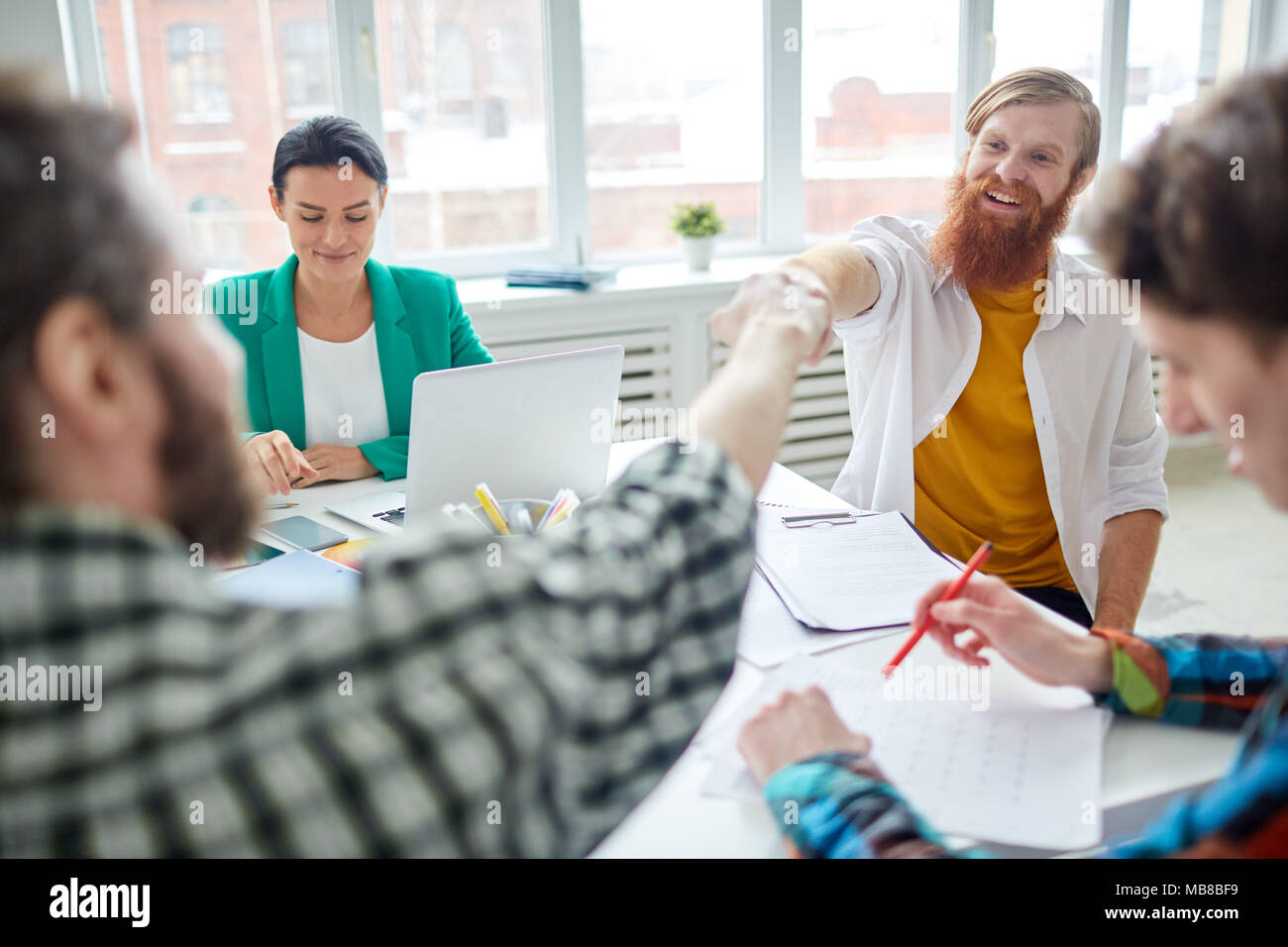 Business team hand bump after work success in the office Stock Photo ...