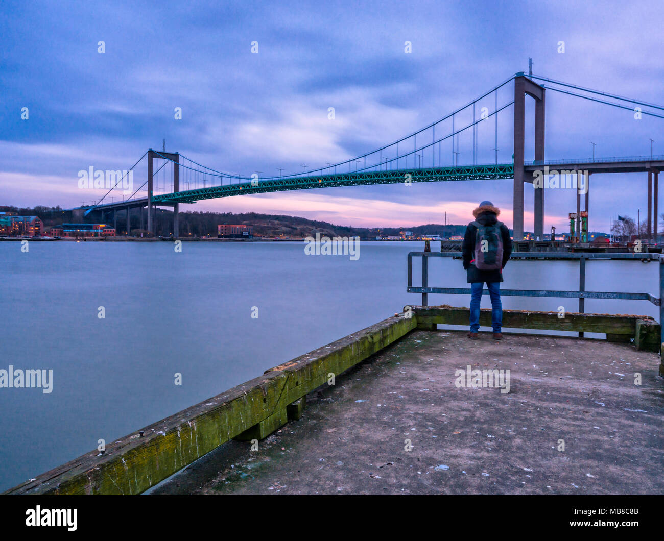 Young adult enjoying sunset through Suspension bridge at Gothenburg ...