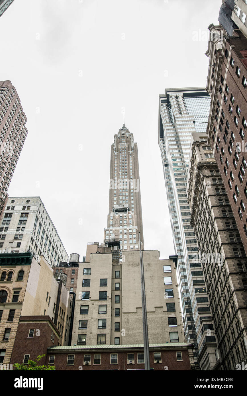 A mix bag of buildings in NYC with the Empire State Building in the ...