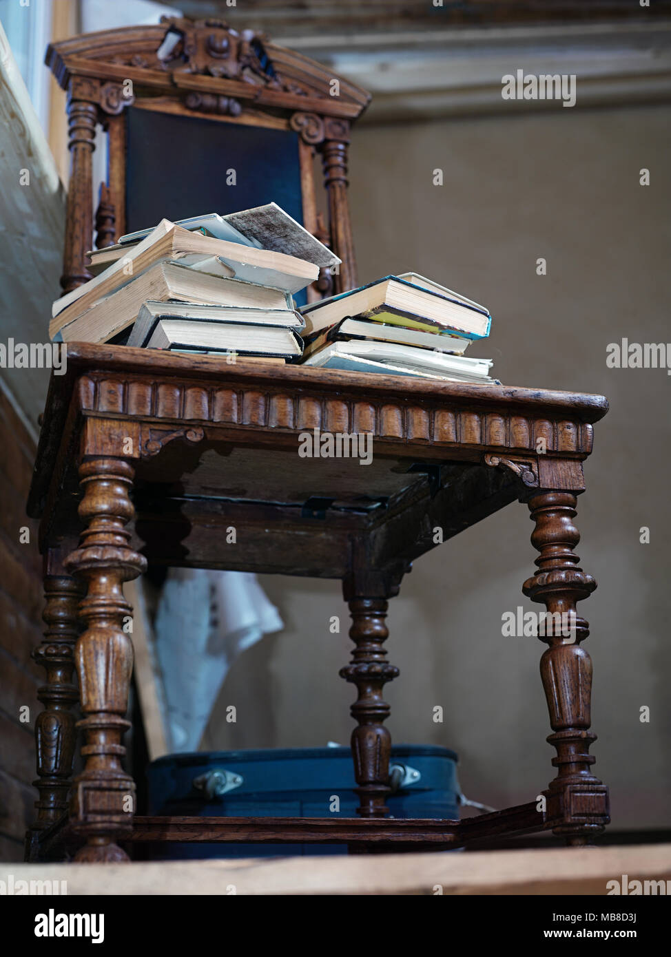 Stack of old books on a vintage chair, vertical indoor shot Stock Photo ...