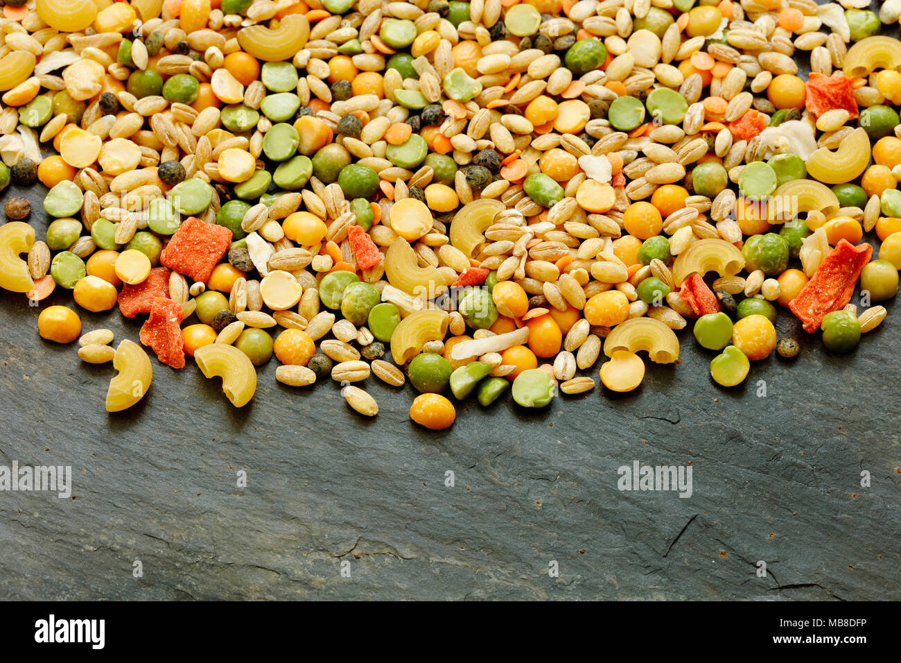 Mixed dried vegetables and pasta for vegan stew or soup with copy space ...