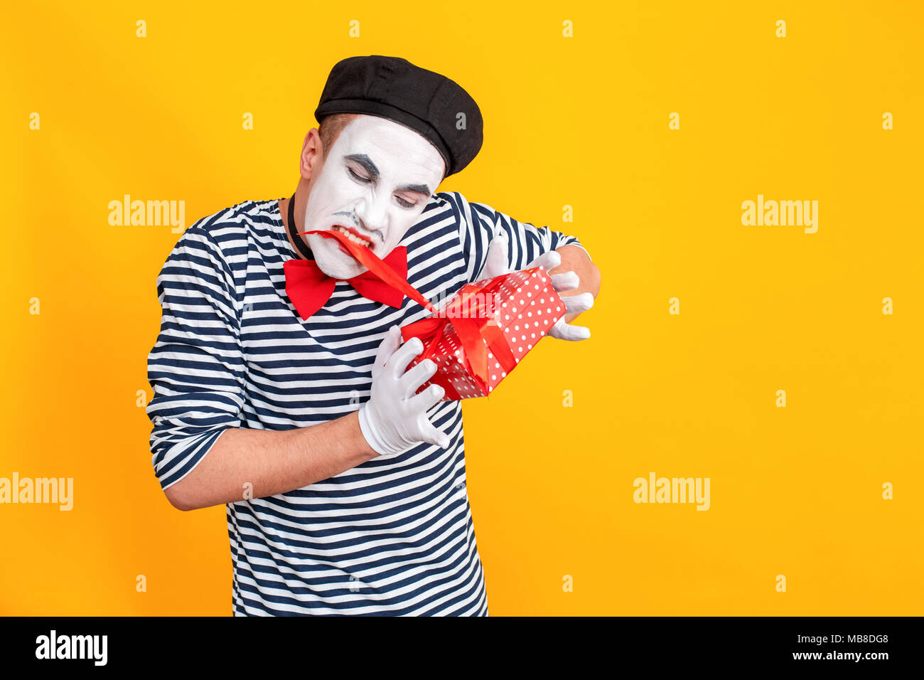 Crazy mime man open with expression red gift box . Emotions and ...