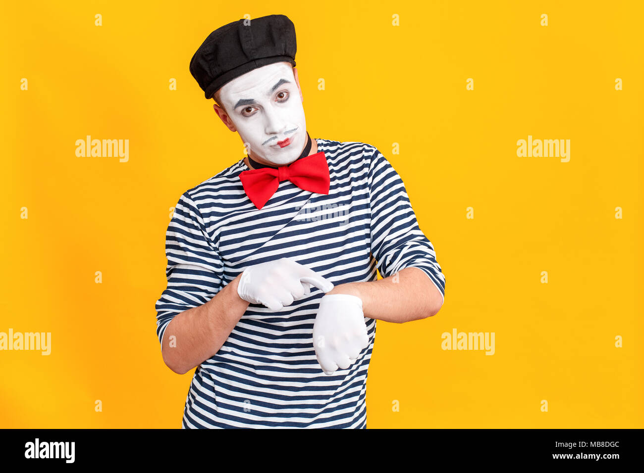 Portrait of serious mime man. You don't have mory time. Time is up ...
