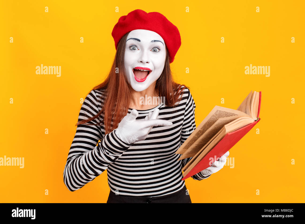 Portrait of cute mime woman is teacher. Holding book. Emotions and ...