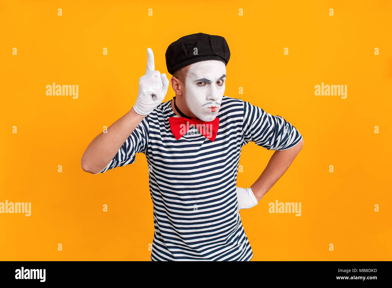 Mime man showing one finger up. Last chance. Emotions and feelings ...
