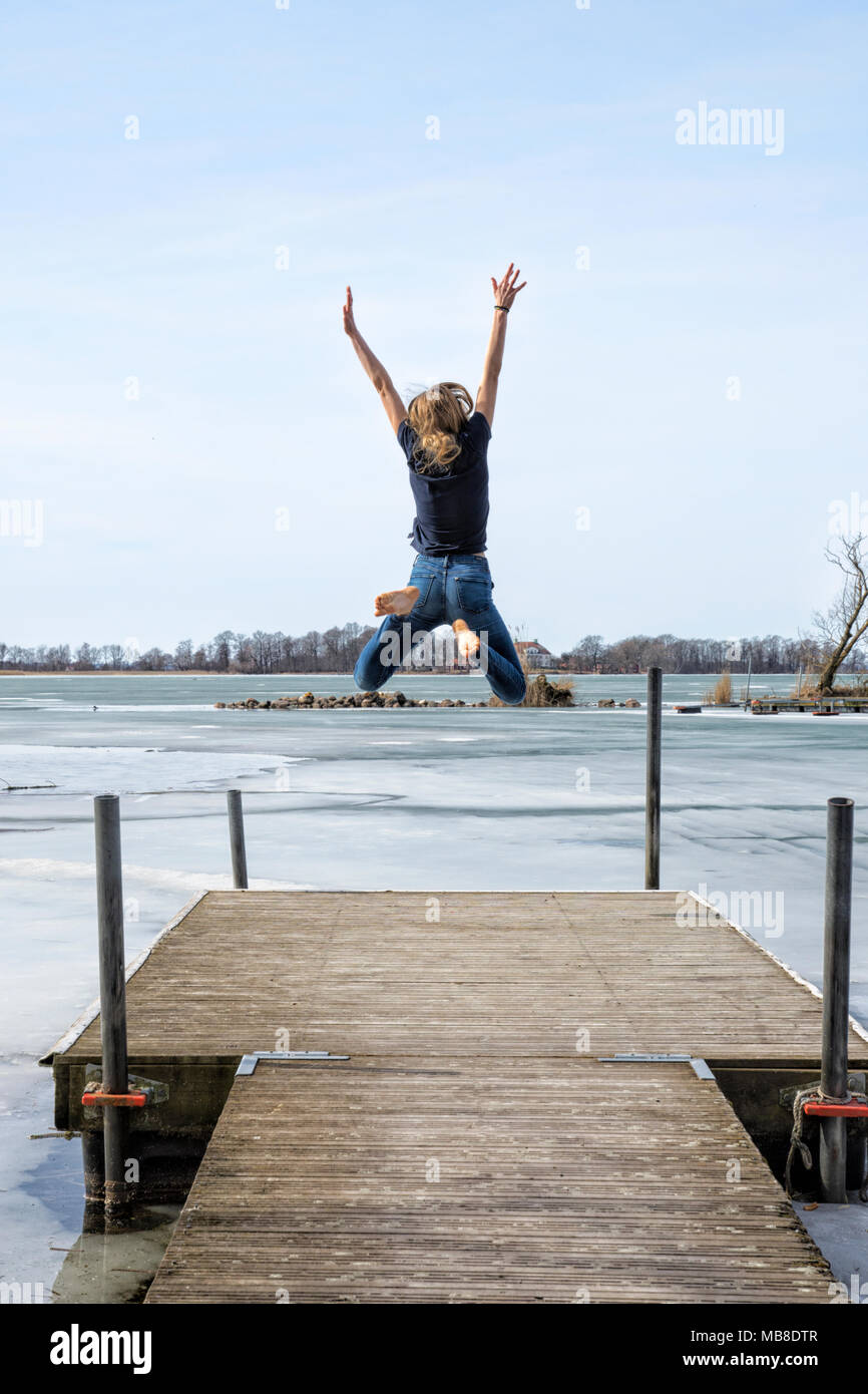 Positive girl jumping hi-res stock photography and images - Alamy