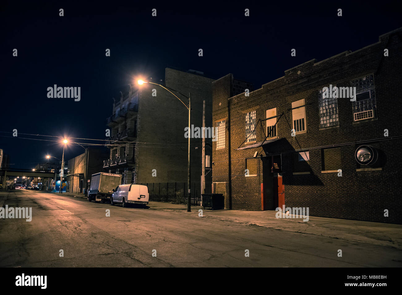 Dark and scary urban industrial city district at night Stock Photo - Alamy