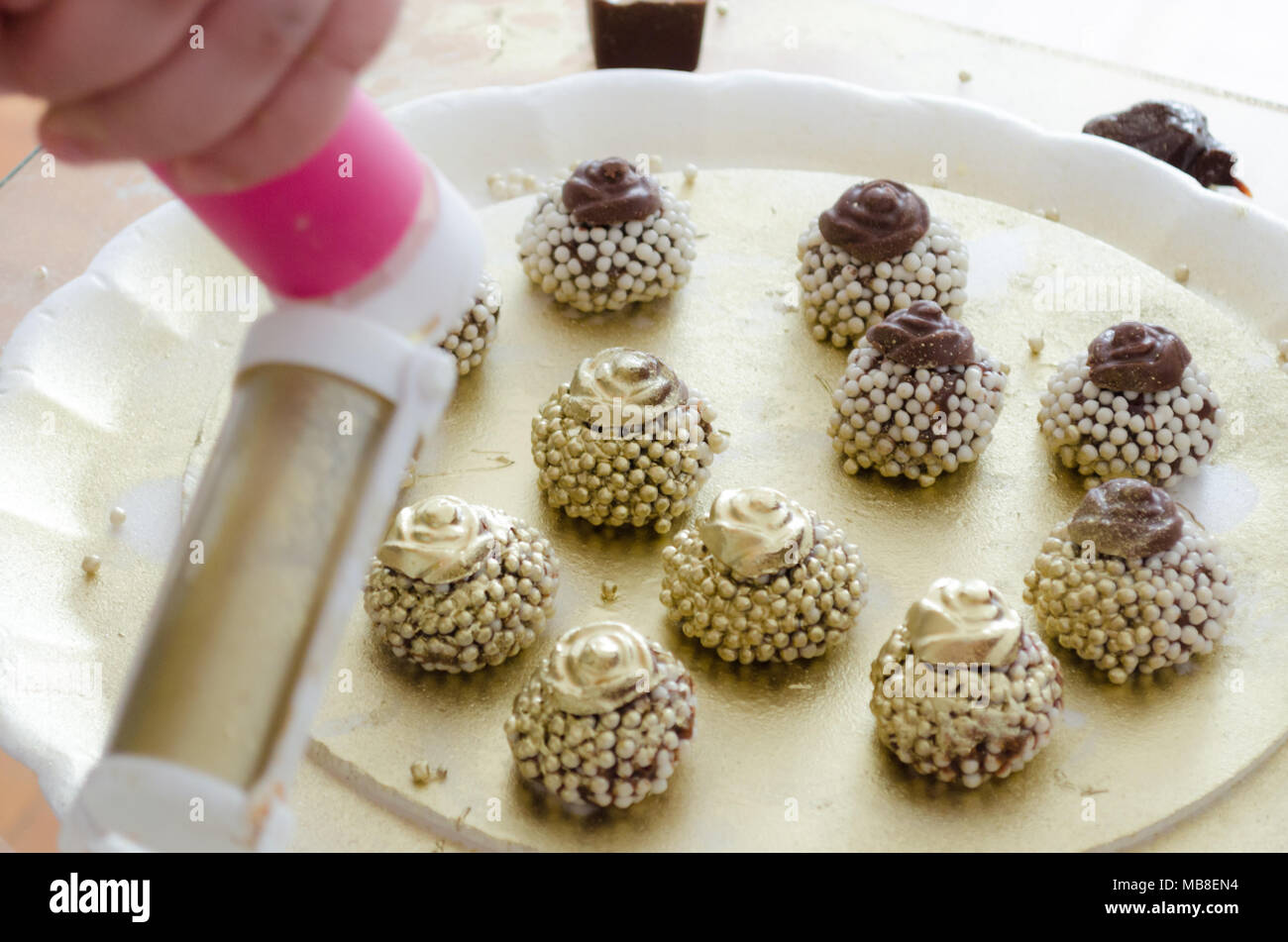 Process of sprinkling paint in chocolate granulated chocolate with ...