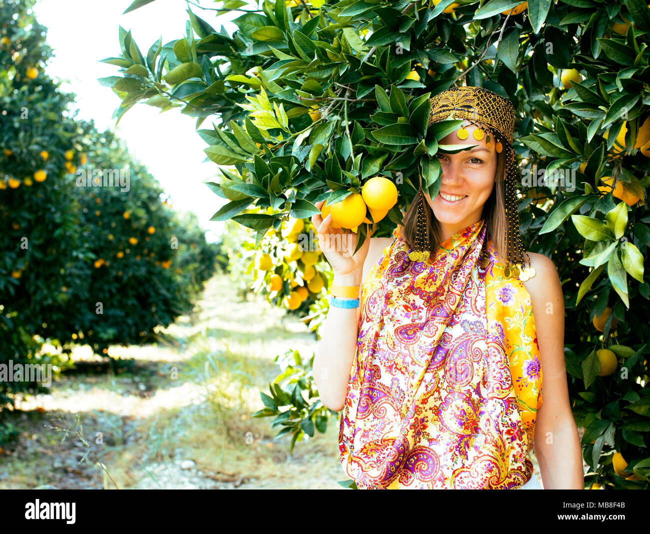pretty islam woman in orange grove smiling, real muslim girl che Stock ...
