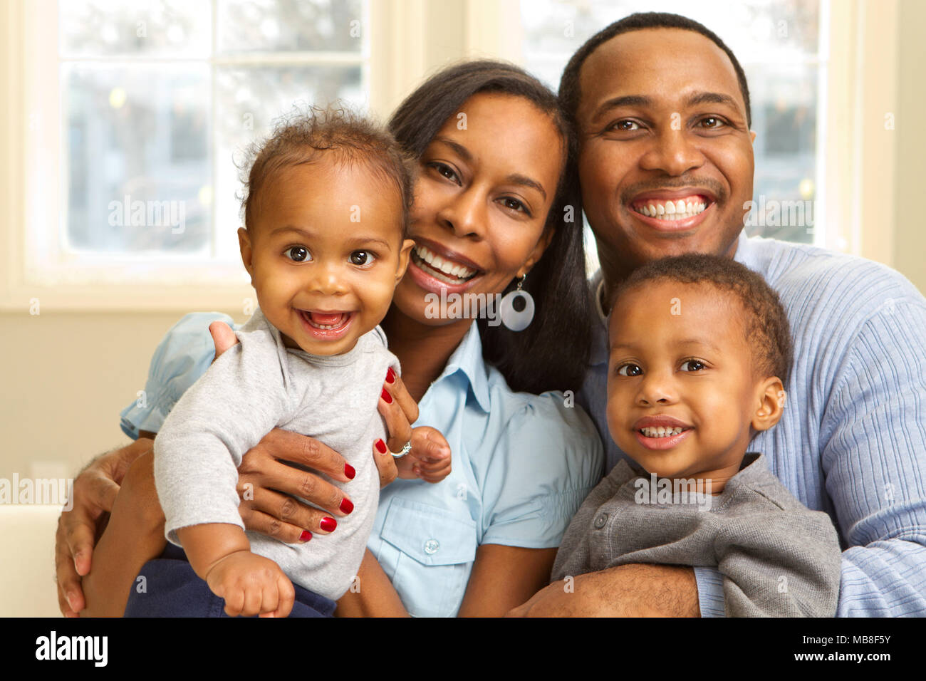 Happy family at home Stock Photo - Alamy