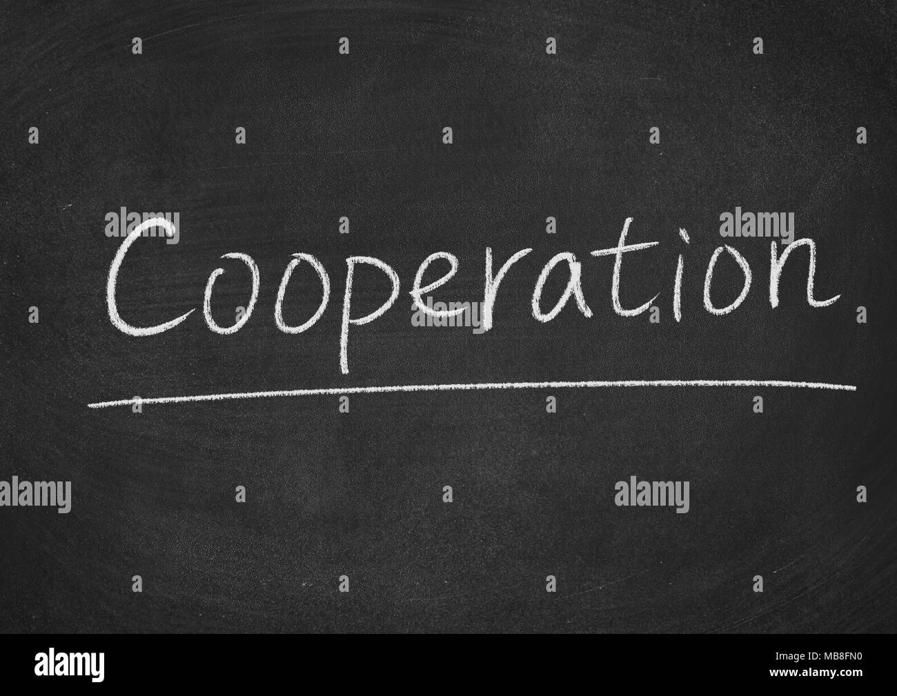 cooperation concept word on a blackboard background Stock Photo - Alamy